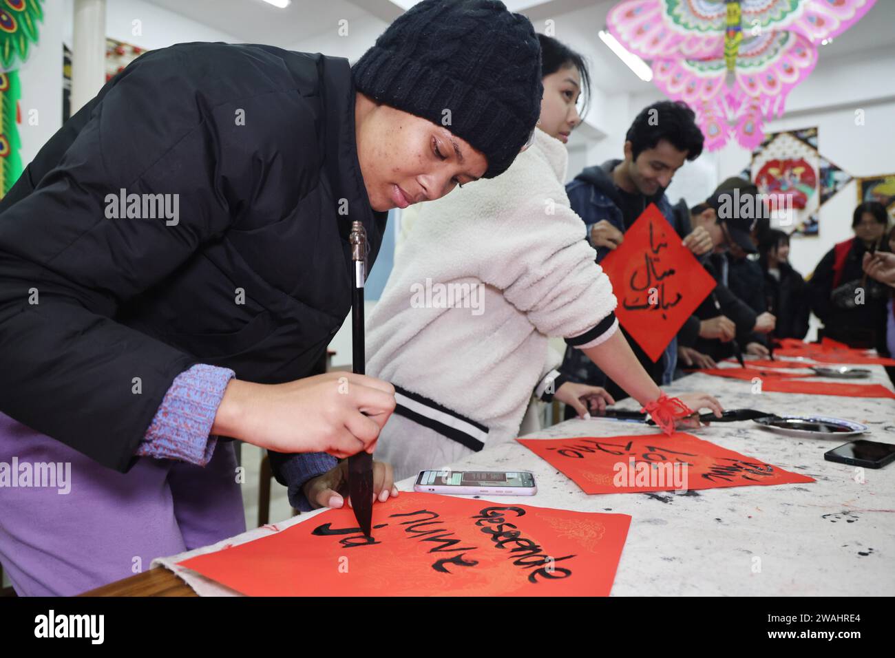 Foreign students learn brush writing in Nantong City, east China's ...