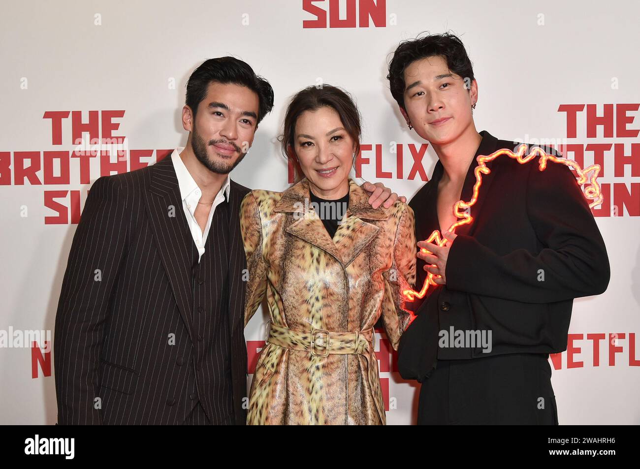 Justin Chien, from left, Michelle Yeoh and Sam Song Li arrive at the premiere of "The Brothers ...
