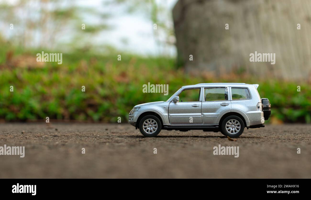 Concept for traveling and outdoor activities. Photo of a toy car on the ...
