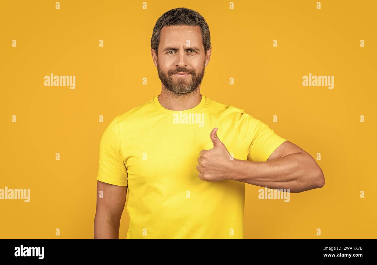 cheerful man approve on background. man approve in studio. photo of man ...