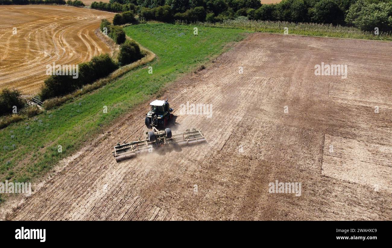 Agricultural work, tillage with a tractor Stock Photo - Alamy