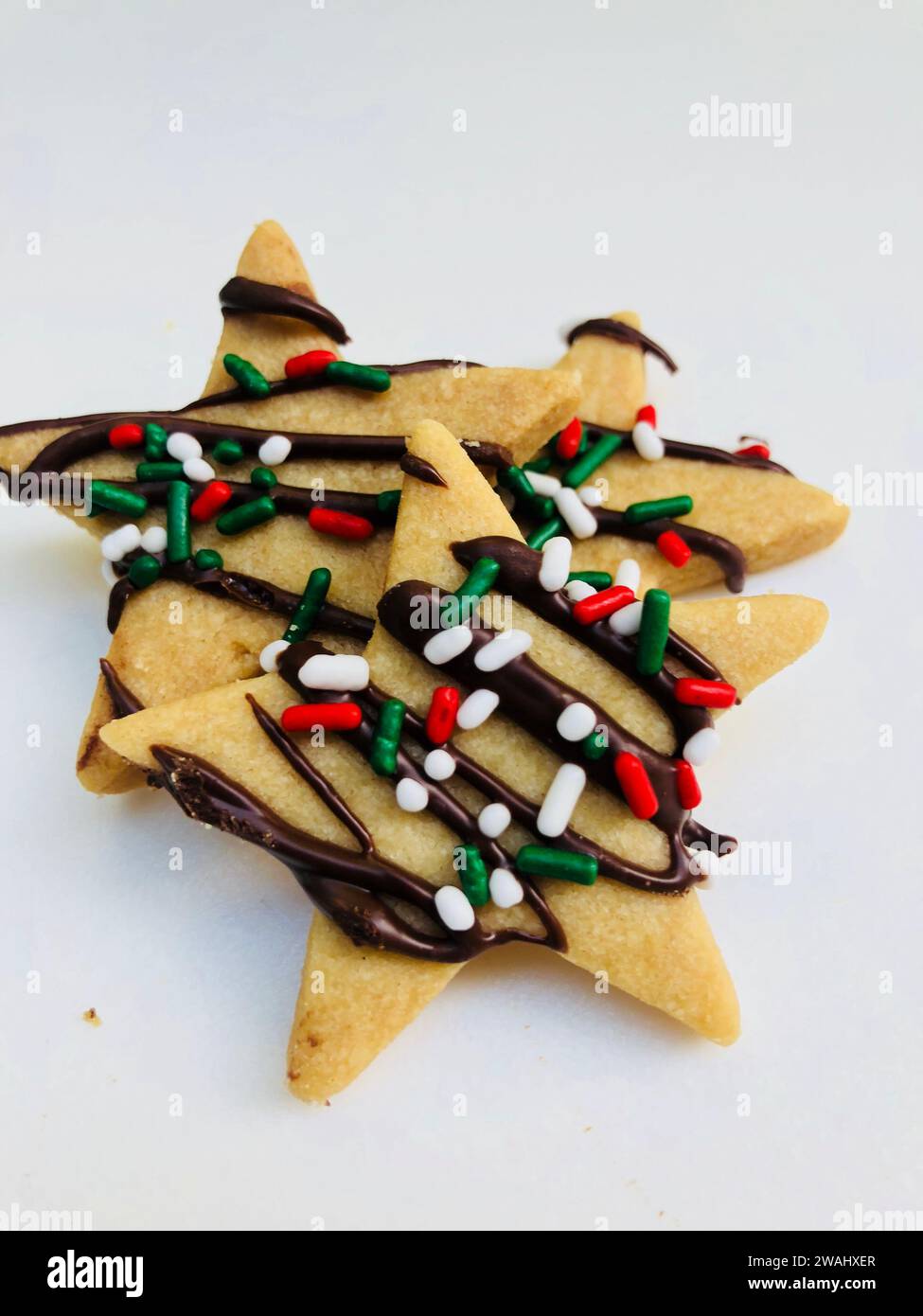 Star shaped Christmas shortbread cookies decorated with chocolate ...