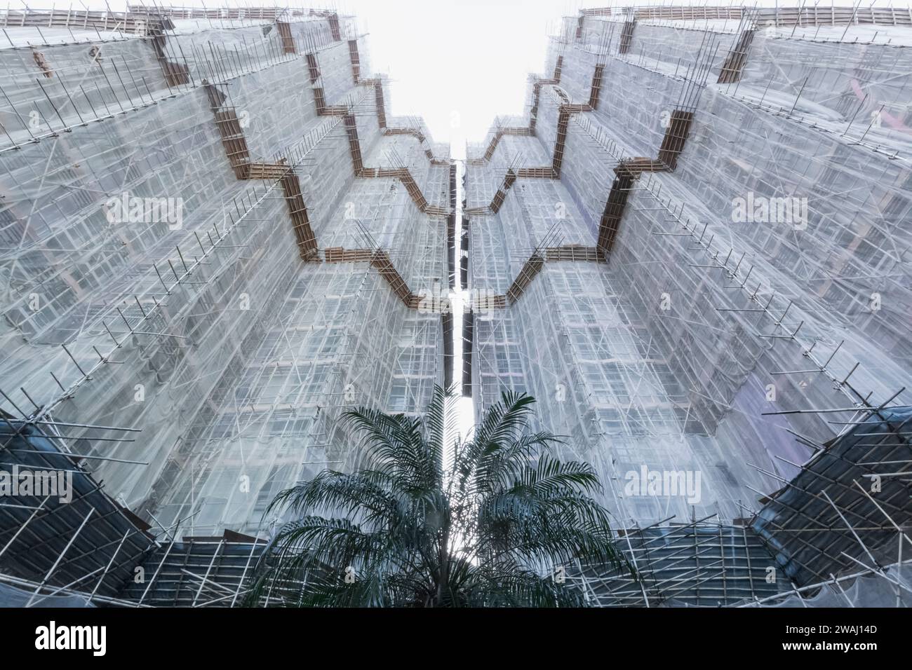 China, Hong Kong, Lantau Island, Discovery Bay, Scaffolding Covered Hi-rise Apartment Blocks ...