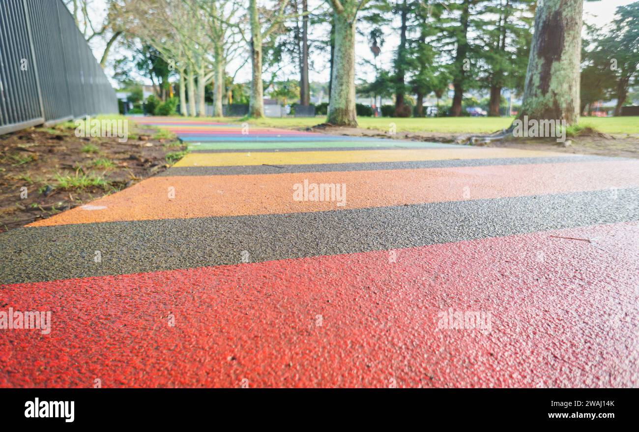 Curved footpath painted with rainbow colours Stock Photo - Alamy