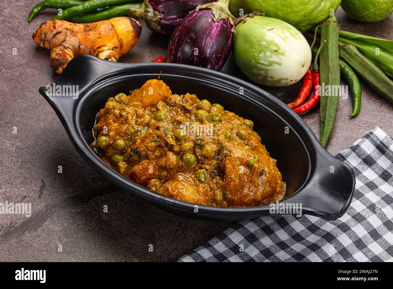 Indian traditional cuisine Aloo mutter - potato with green peas Stock ...