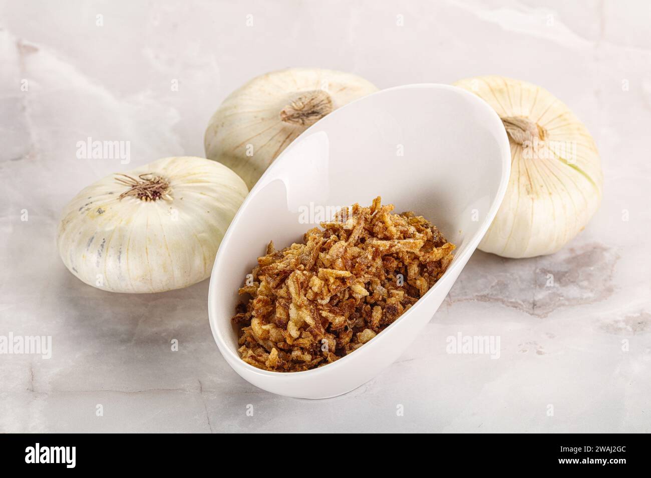 Dried roasted onion crunchy flakes for culinary Stock Photo - Alamy