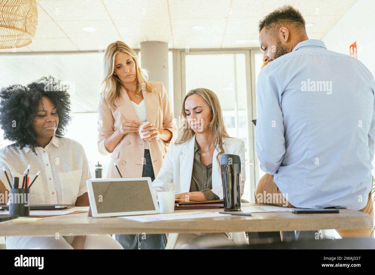 Business team sharing ideas for a startup project while working ...