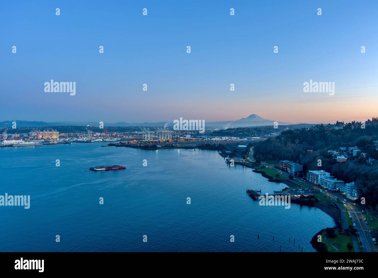 Aerial view of Mount Rainier and West Seattle at sunset in December ...