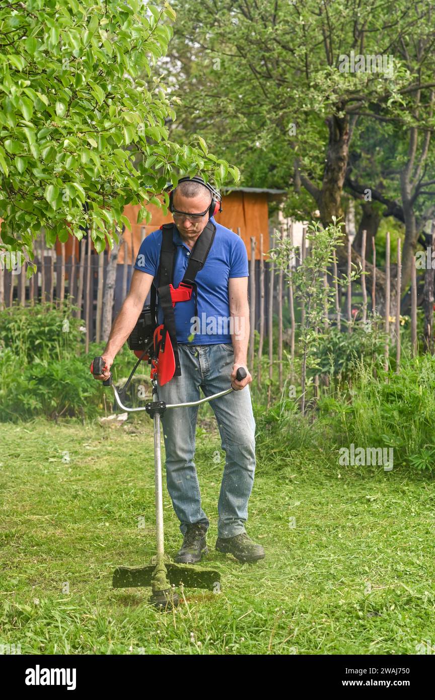 lawn trimming with hand mower. High quality photo Stock Photo - Alamy