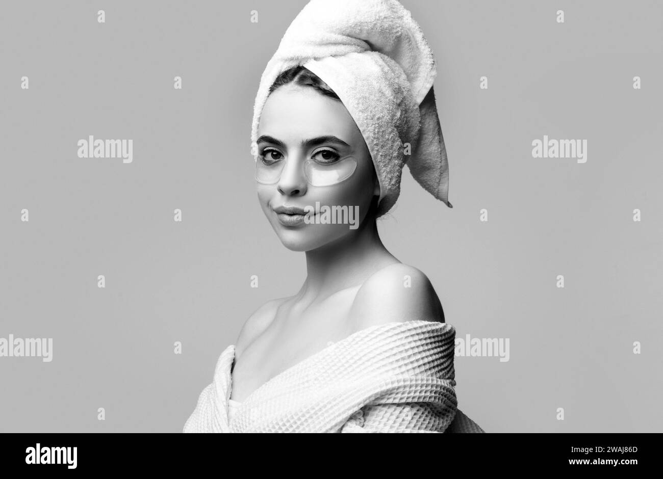 Beauty woman with eye patches showing an effect of perfect skin. Close ...