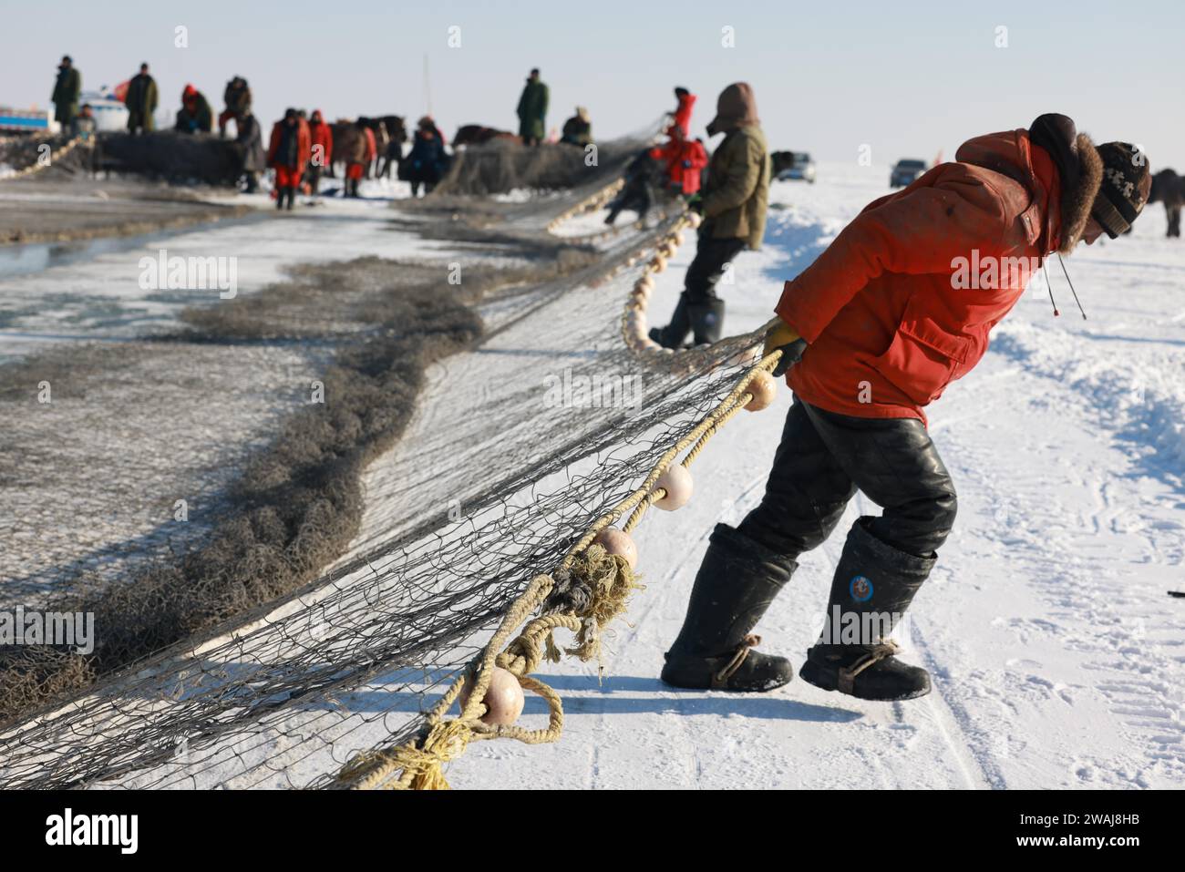 Fishermen catch fish on the frozen Chagan Lake in Songyuan City ...
