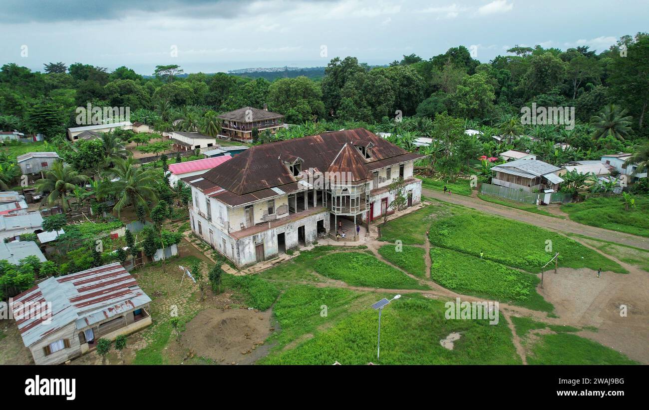 An isolated traditional wooden house stands in a rural landscape ...