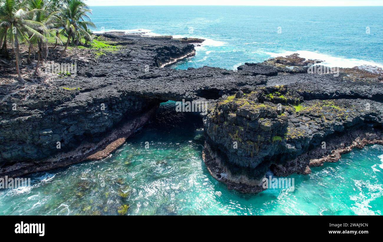 An aerial landscape view of a stunning cliff face featuring a bridge ...