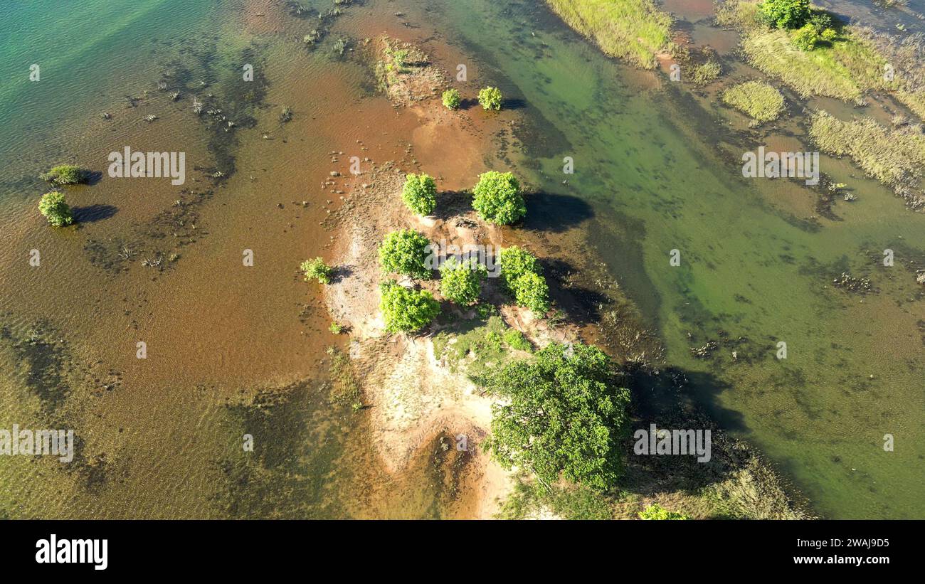 This aerial photo captures a stunning view of a beach, featuring the ...