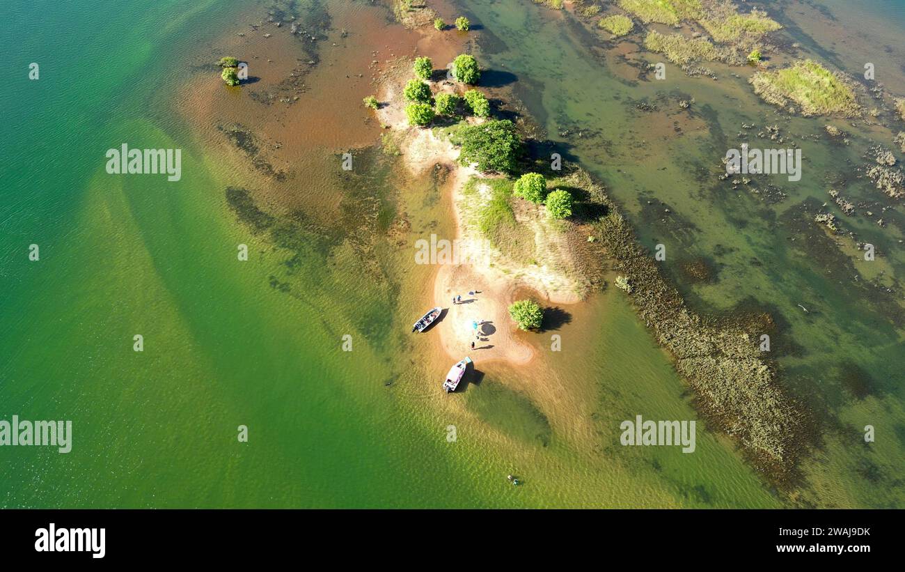Aerial view of a coastal area, featuring a blend of land and sea, with ...