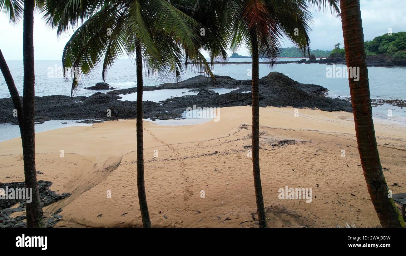 This stunning image features a beach with white and light gray sand ...
