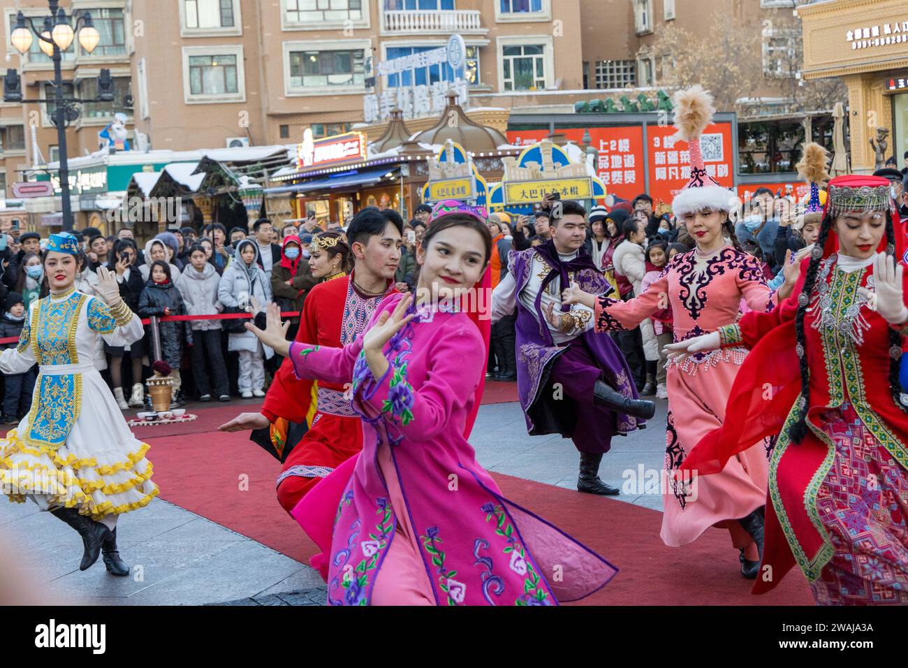 Tourists visit the Xinjiang International Grand Bazaar in Urumqi City ...