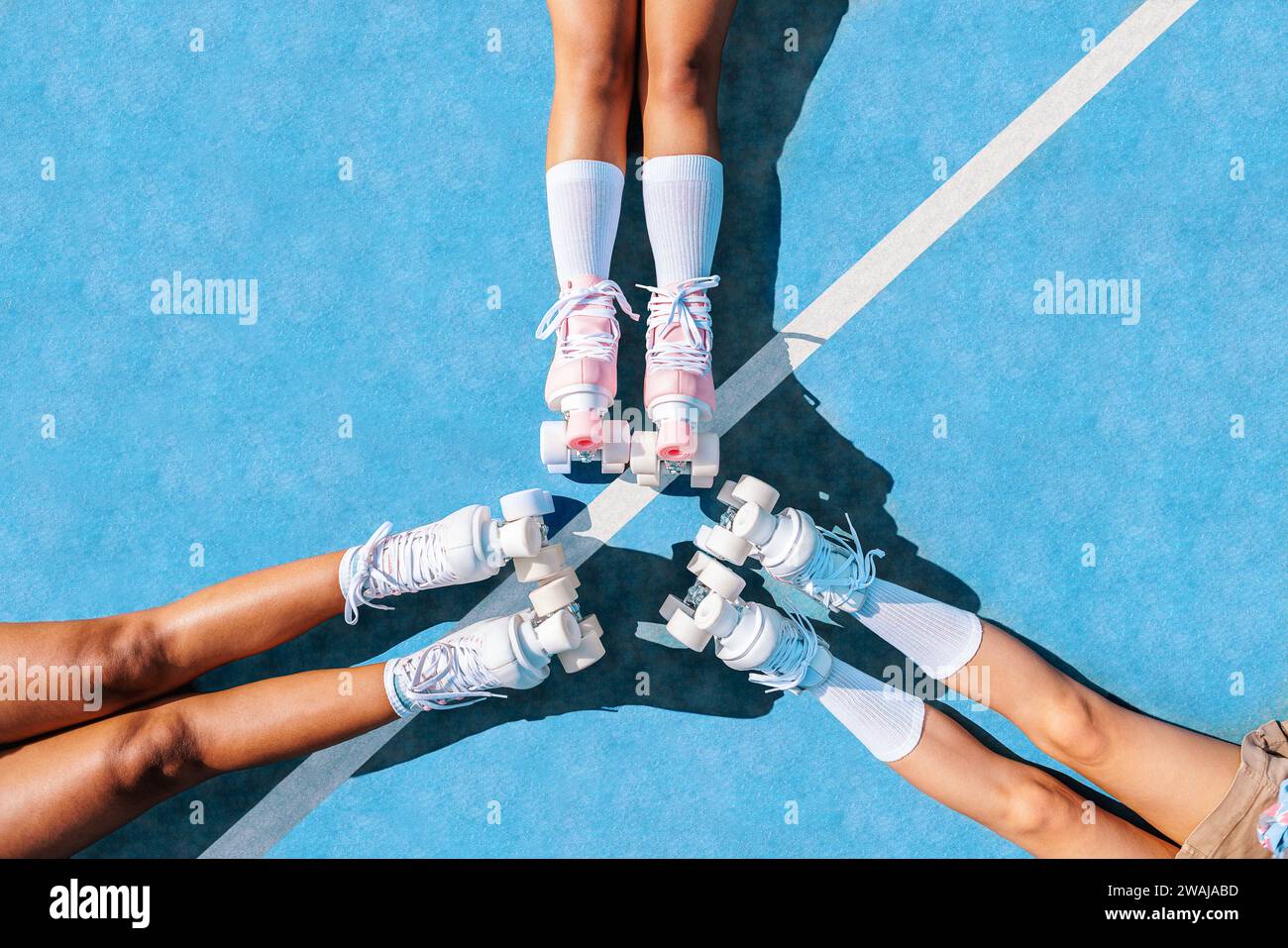 From above of crop anonymous young African American females in colorful ...