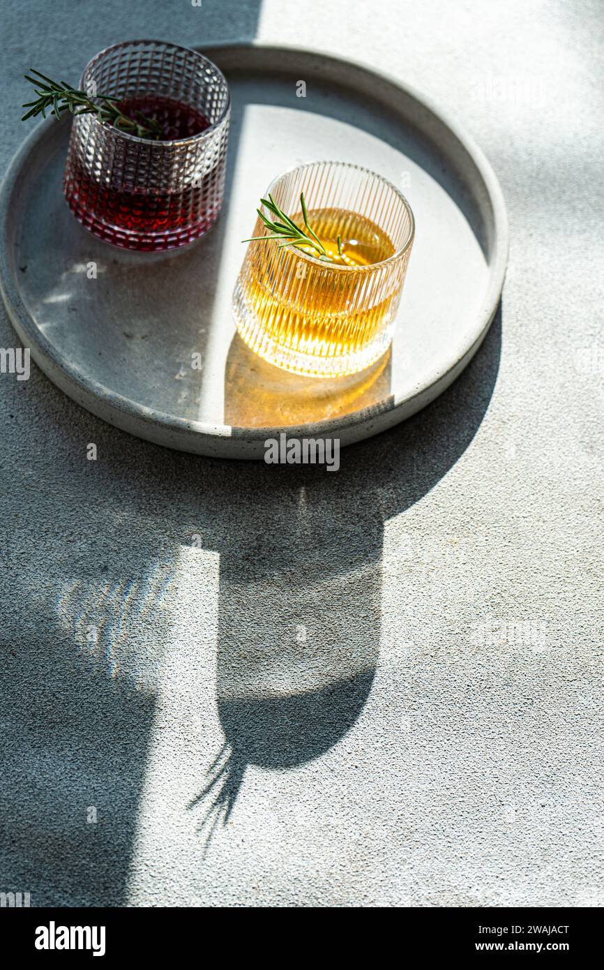 From above of artisanal cocktails with vodka cherry, and apple juice in ...