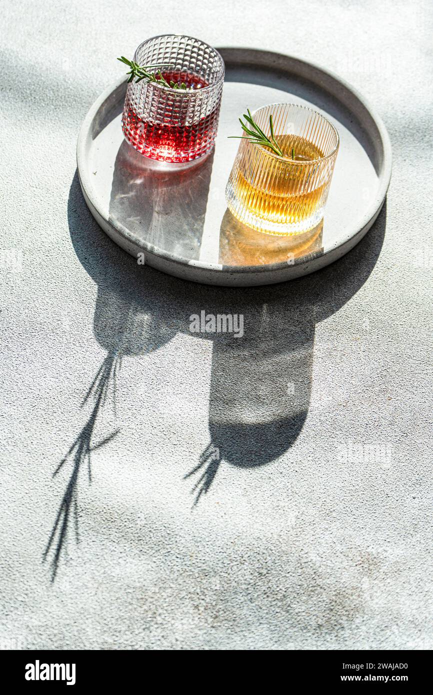 From above of artisanal cocktails with vodka cherry, and apple juice in ...