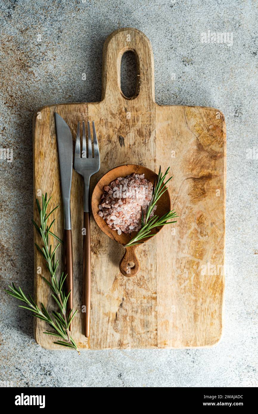 From above rustic kitchen setup on wooden cutting board with a fork ...