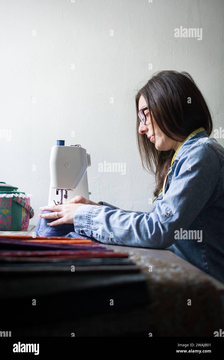 Woman deeply concentrated on sewing hi-res stock photography and images ...