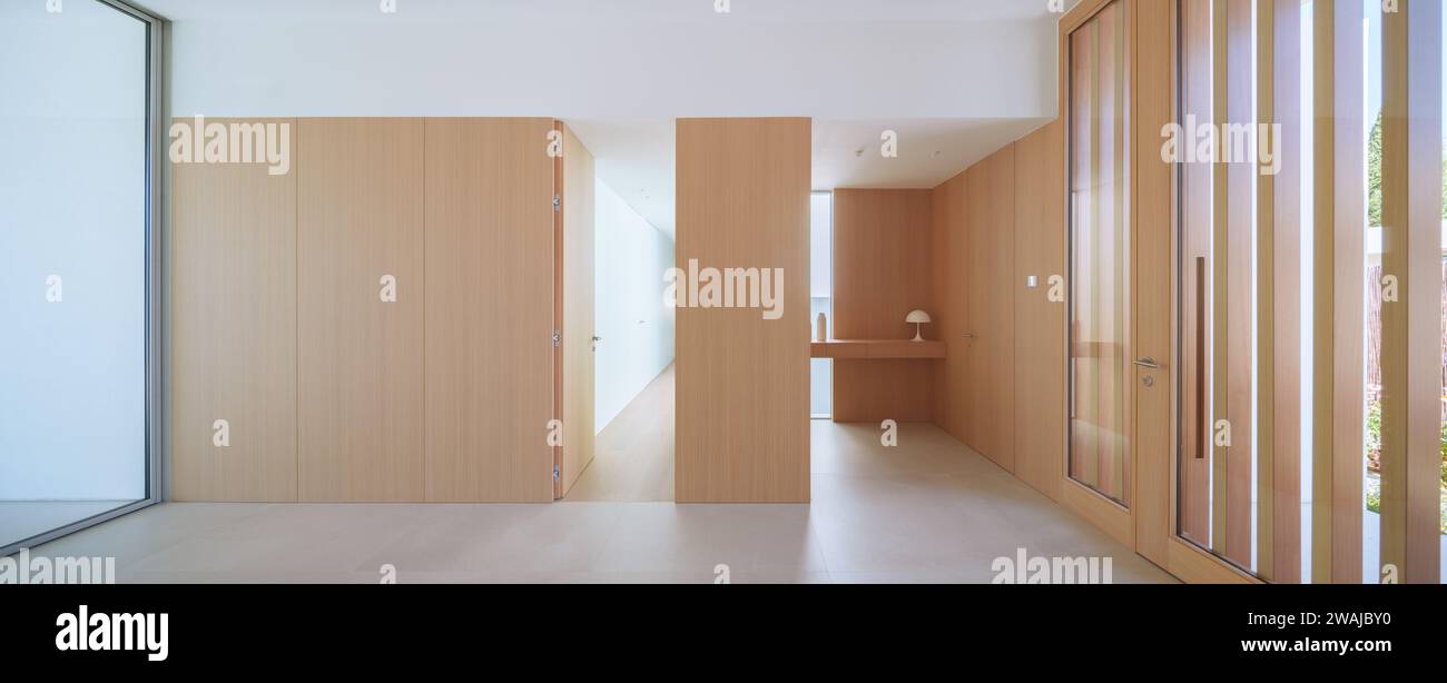 Open plan hallway with wooden partition, stone wall feature, and full ...