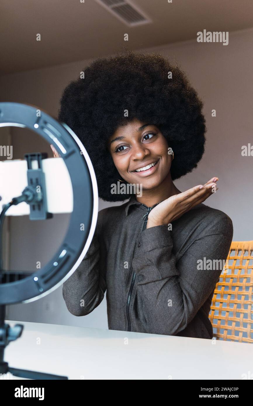 Vertical video african vlogger recording hi-res stock photography and ...