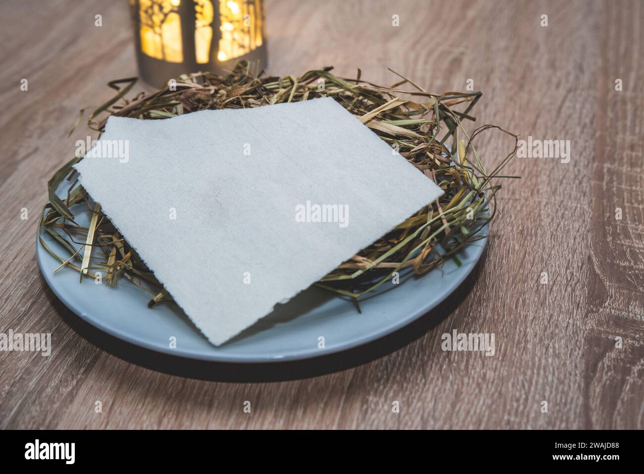 A traditional Christmas wafer sitting on a bed of hay Stock Photo - Alamy