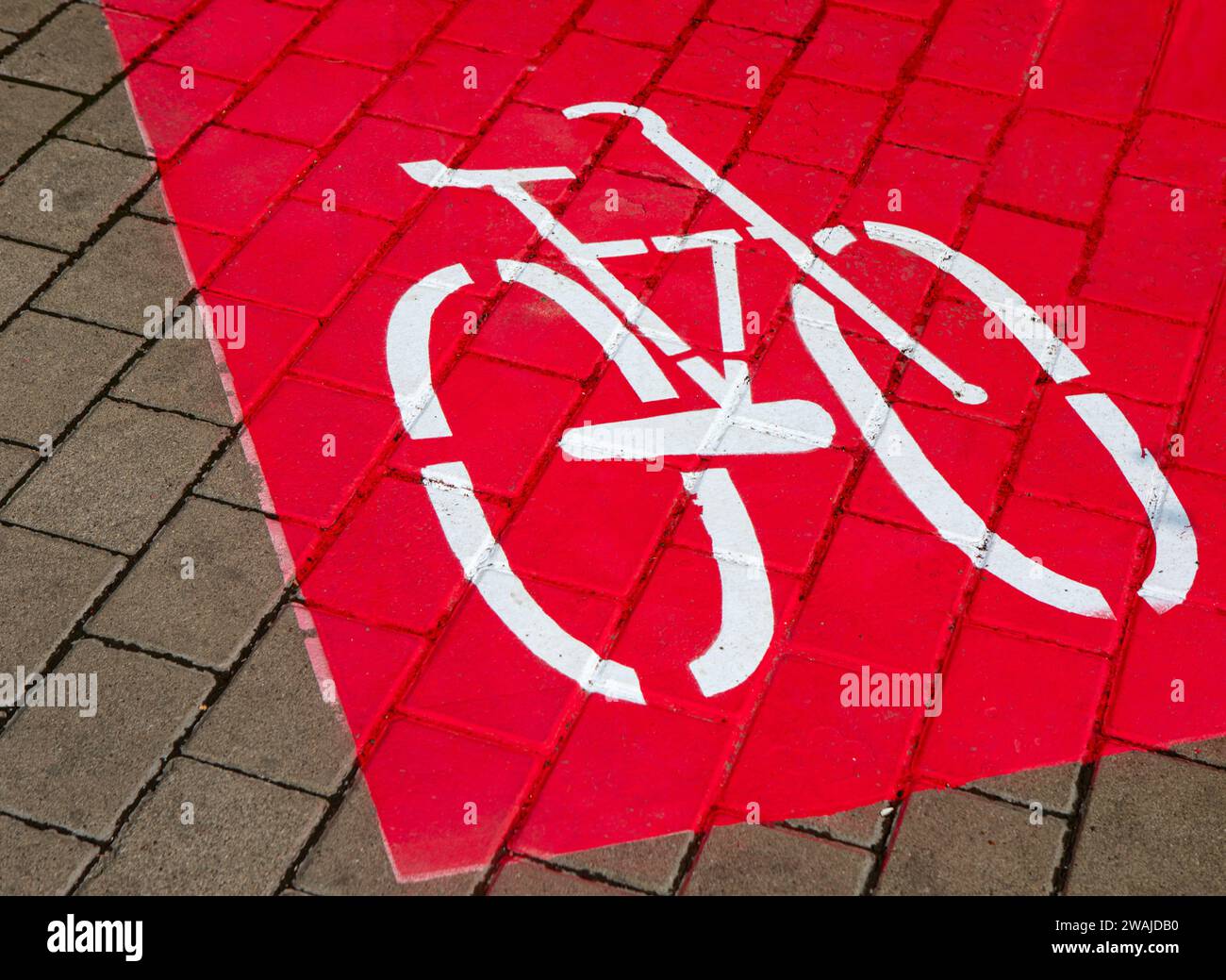 Bicycle parking sign painted on the pavement in the city Stock Photo ...