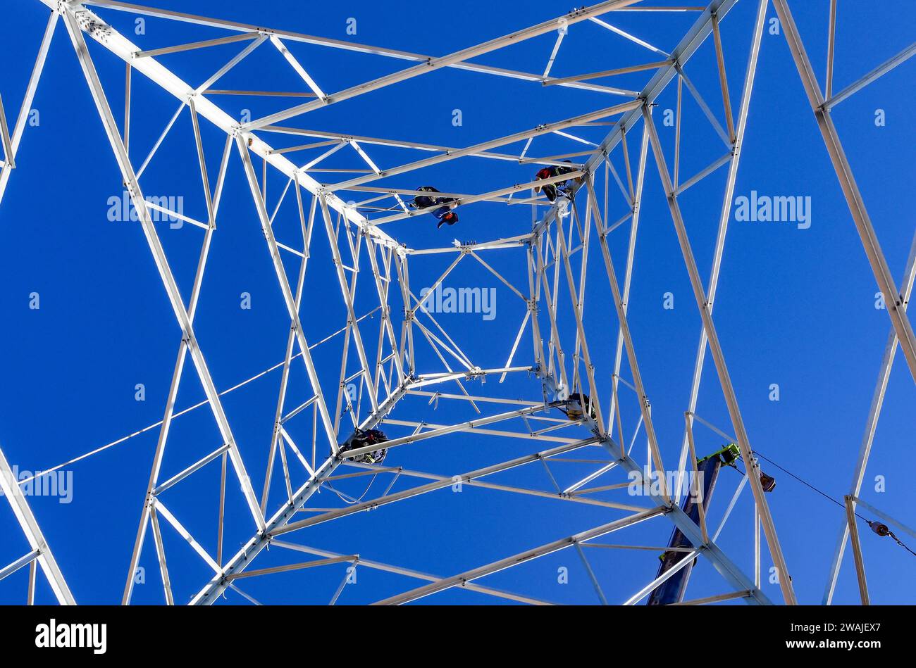 ORDOS, CHINA - JANUARY 5, 2024 - Electricity workers install a power ...