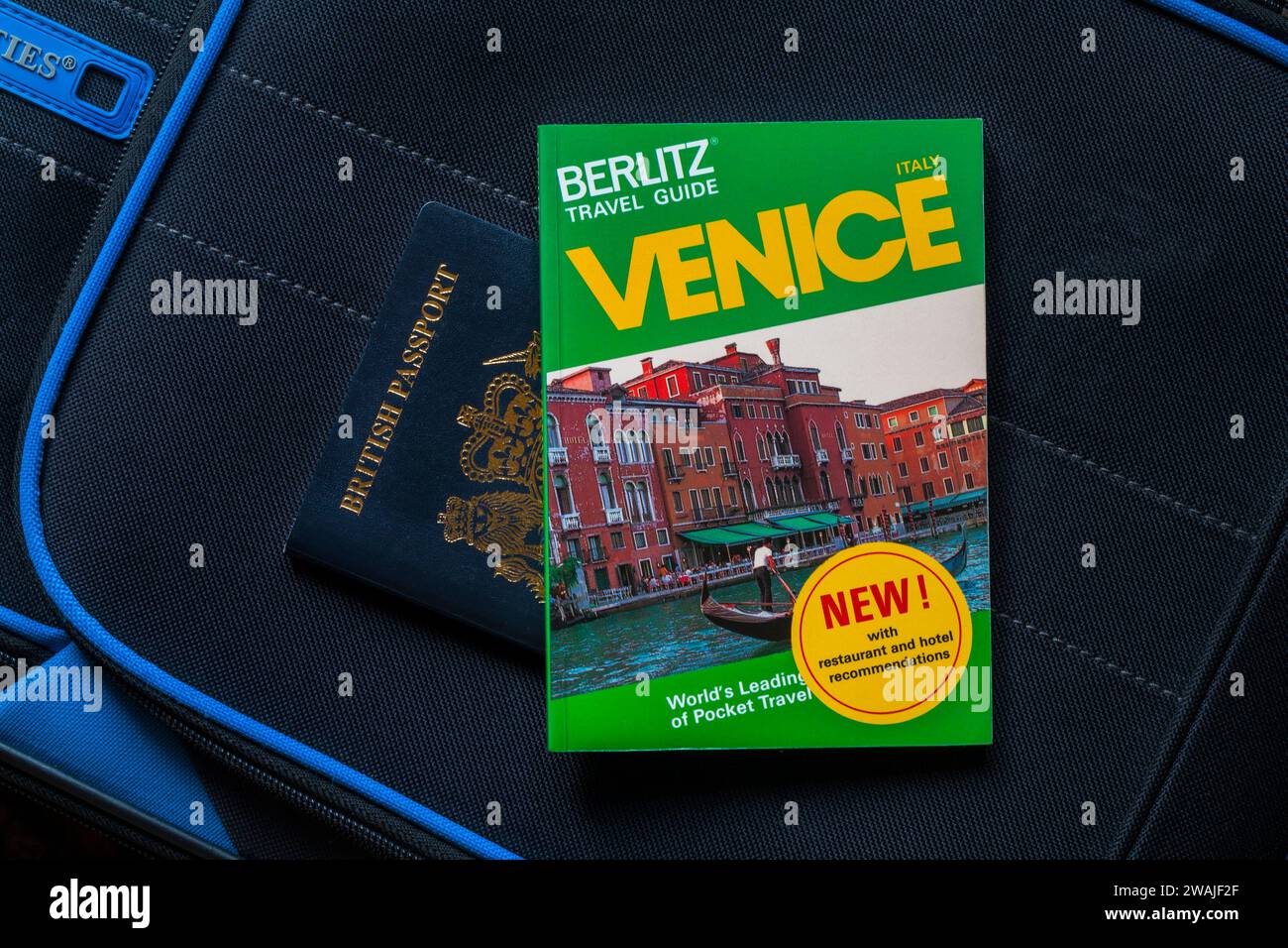 Venice Berlitz Travel Guide book with British passport on suitcase ...