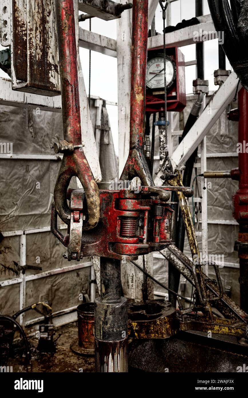 A steel harness used to secure a long length of drilling pipe on an ...