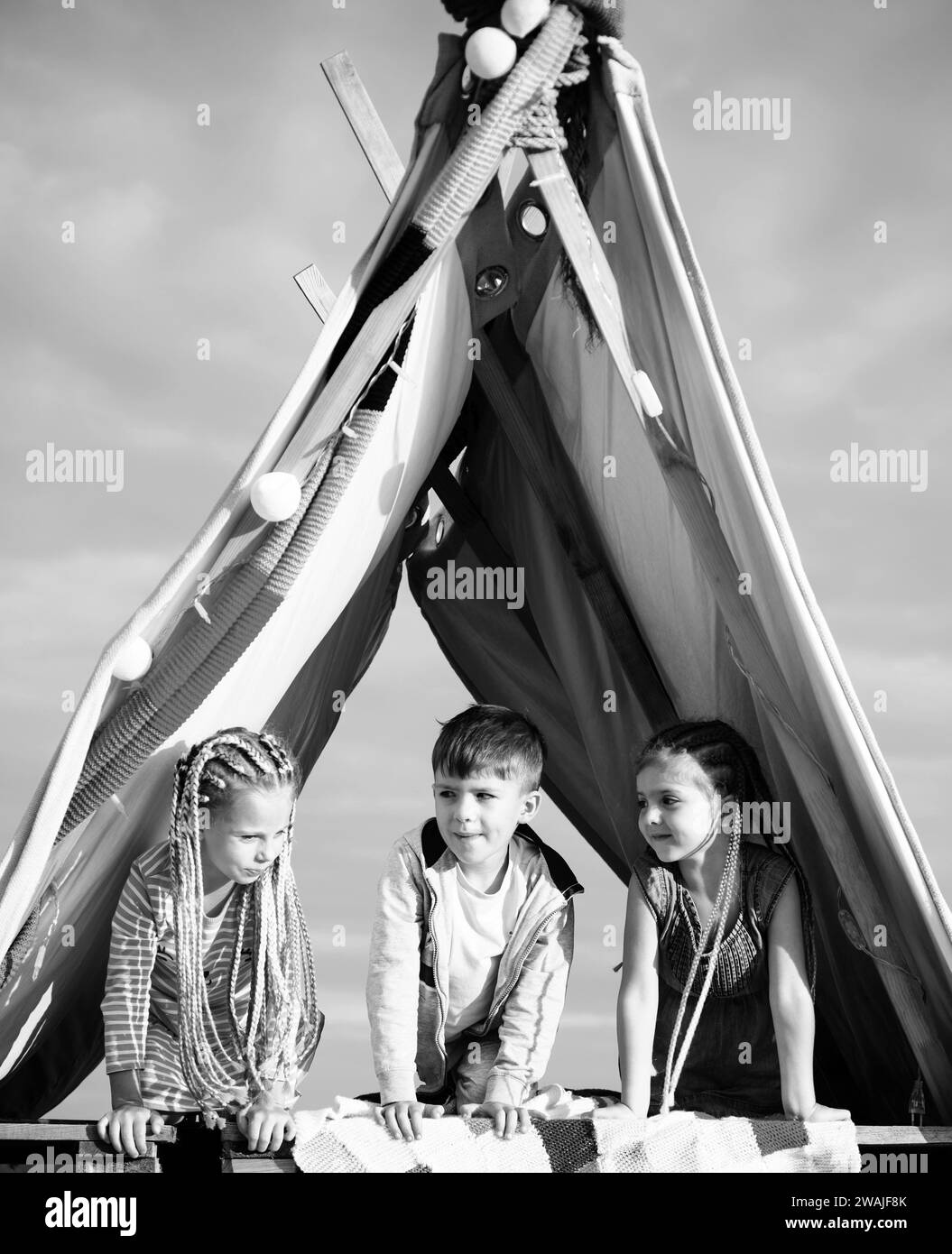 Happy friends camping. Kids in tent outdoor. Happy childhood concept ...