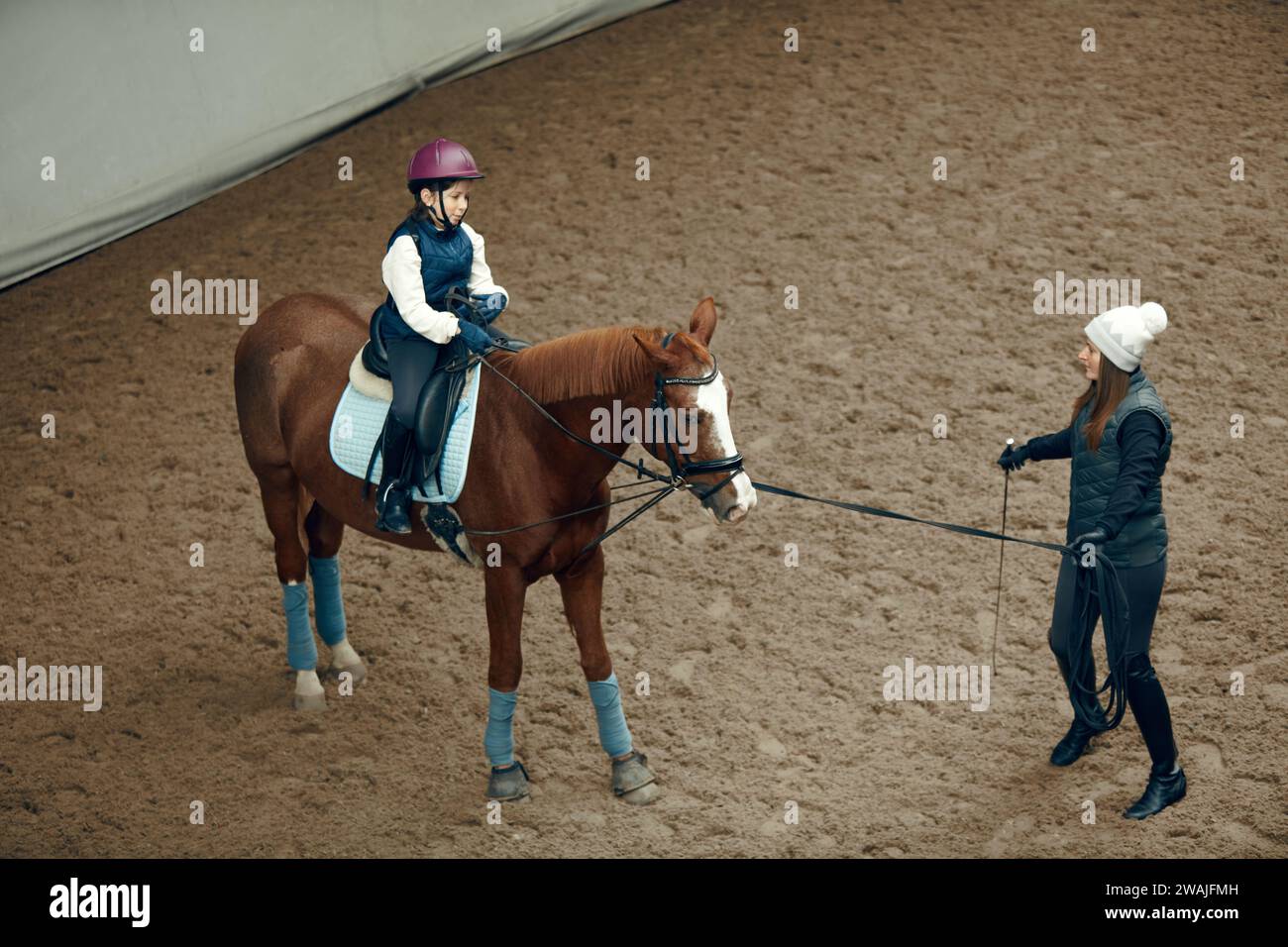 Aerial, top view. Female teacher, instructor teaching little girl, kid ...