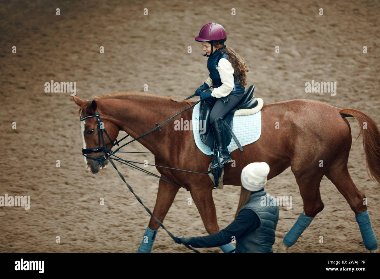 Aerial, top view. Female teacher, instructor teaching little girl, kid ...
