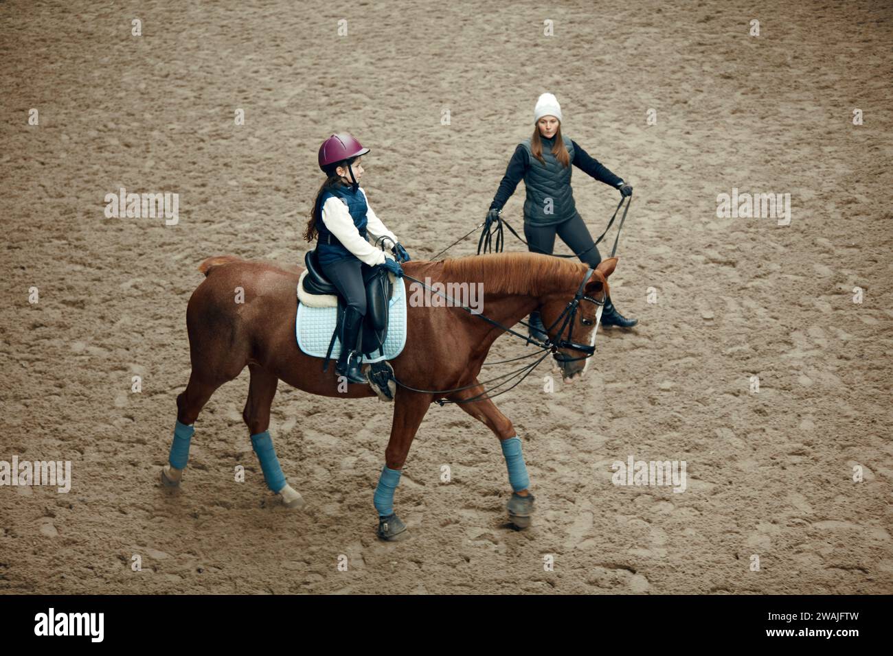 Aerial, top view. Female teacher, instructor teaching little girl, kid ...