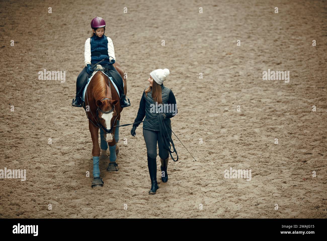 Aerial, top view. Female teacher, instructor teaching little girl, kid ...