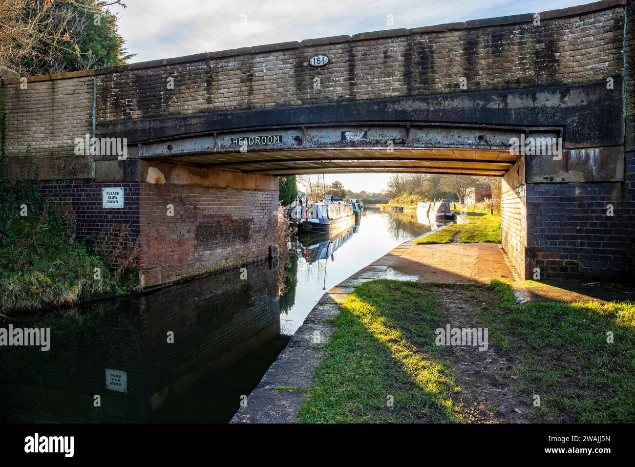 Bridge 161 over Trent and Mersey Canal with moored narrow boats in ...