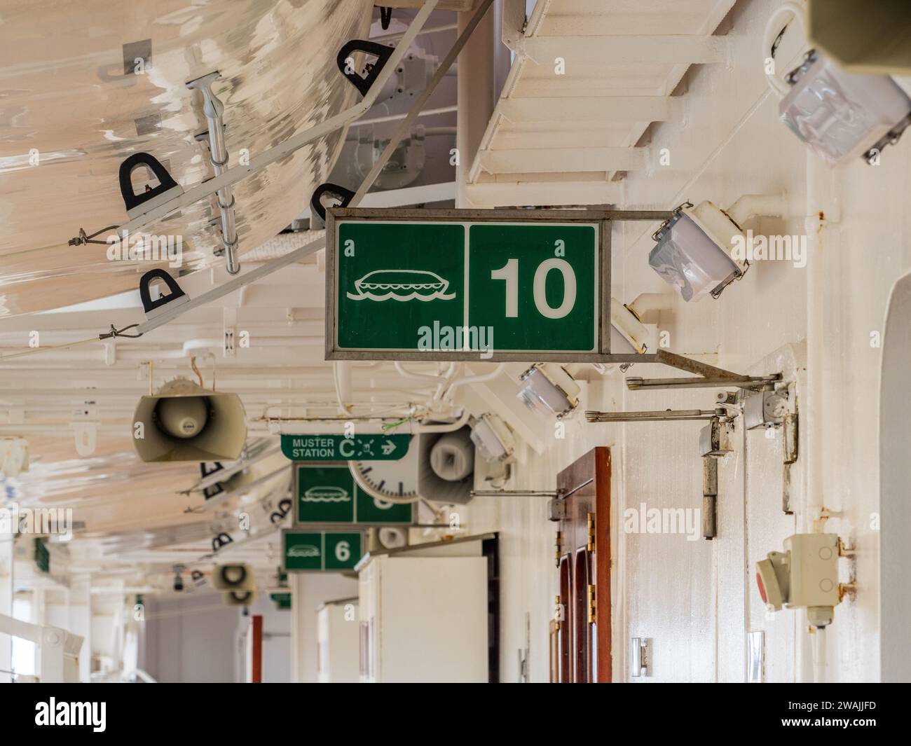 muster station point sign and landing tender emergency dingy location ...