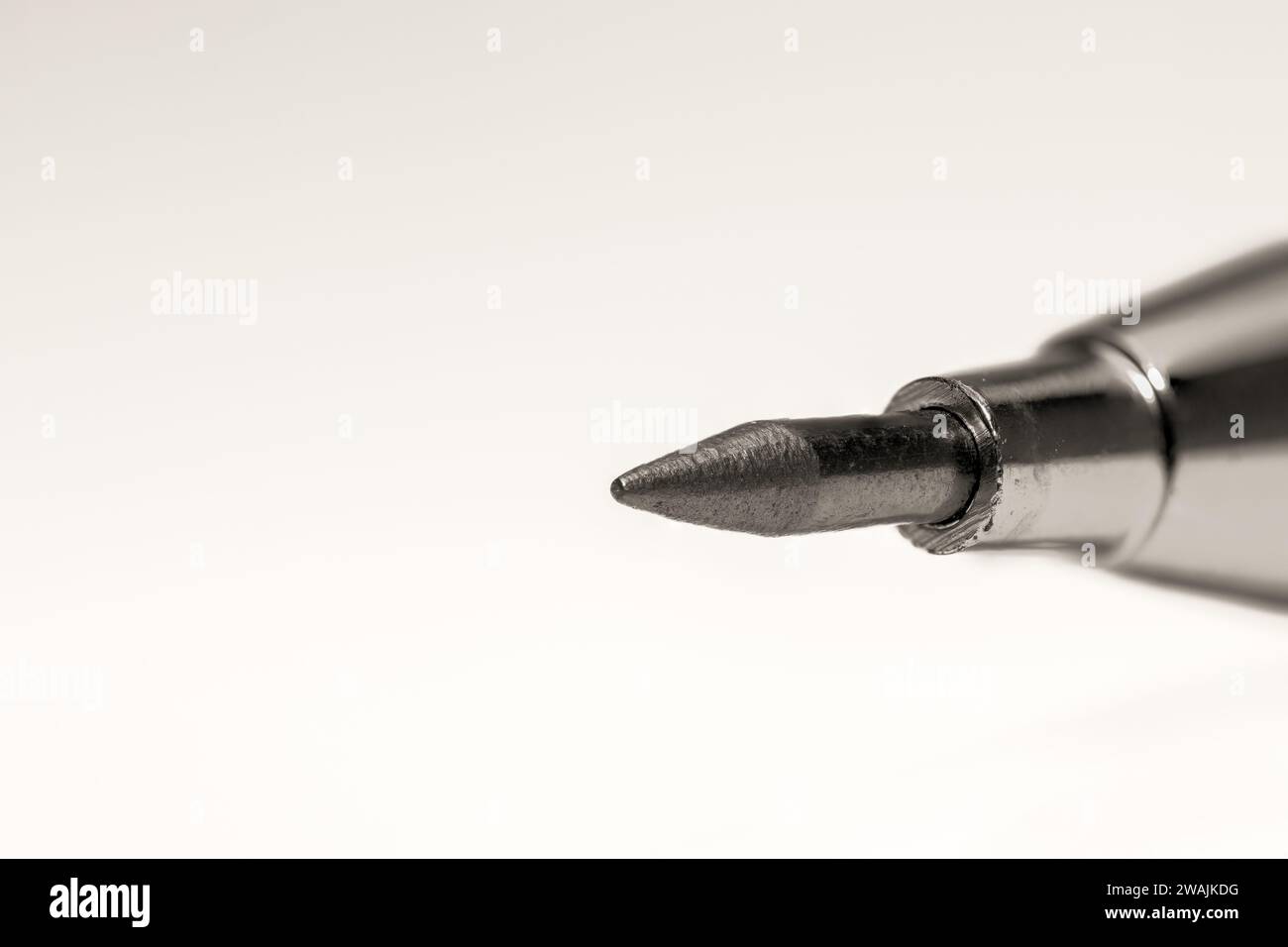 macro close up of the point of a graphite black pencil isolated against ...
