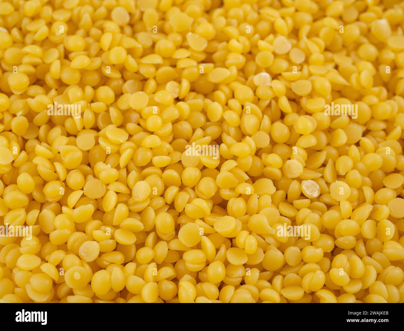 background of yellow pearls of natural beeswax Stock Photo - Alamy