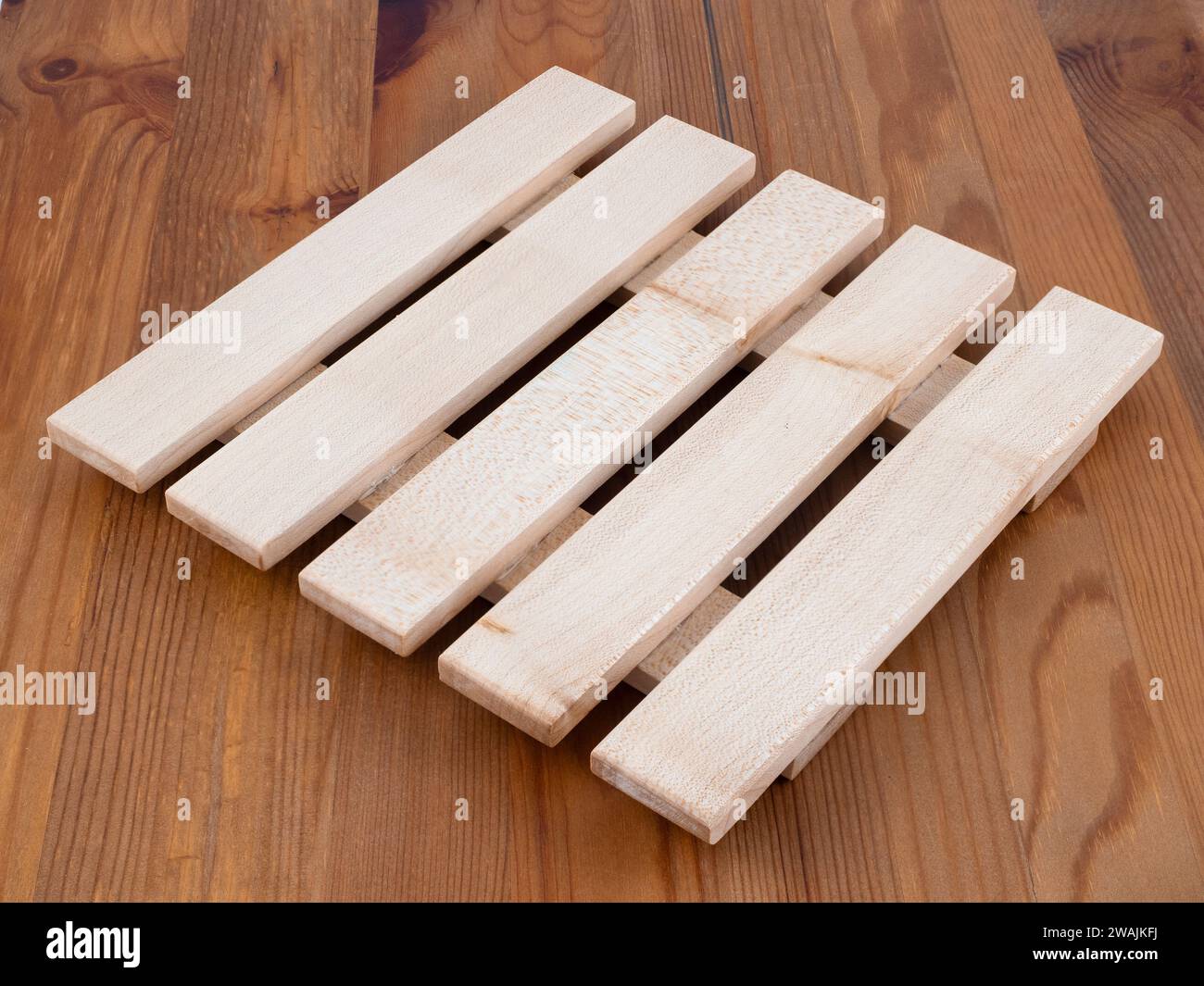 Traditional Classic hard wood hand made hot pan trivet on a kitchen ...