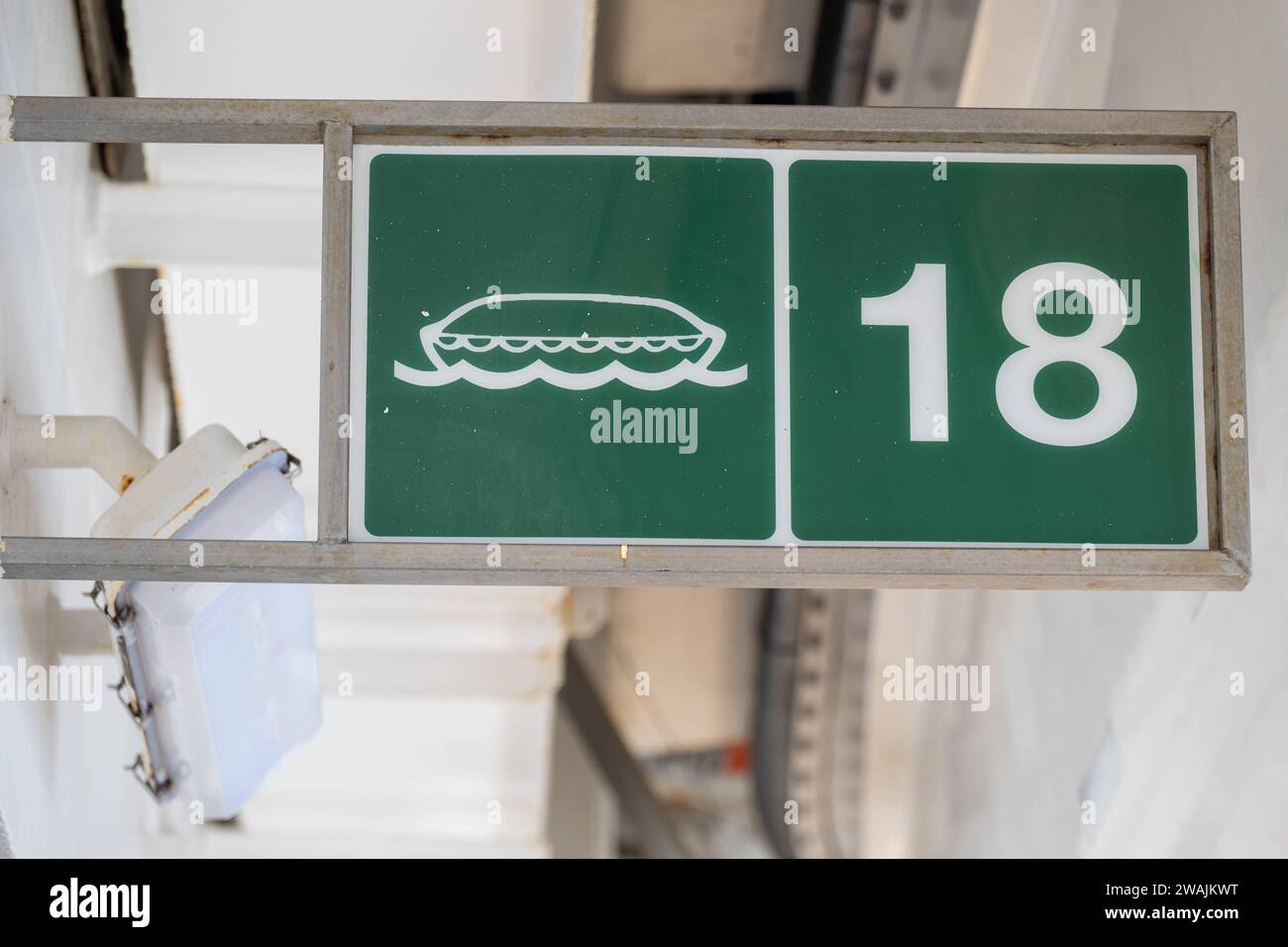 muster station lifeboat sign on a merchant ship cruise liner isolated ...