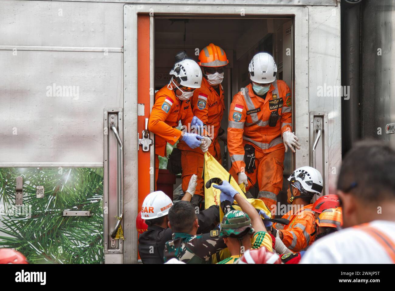 Passengers were being evacuated after the crash on the island of Java ...