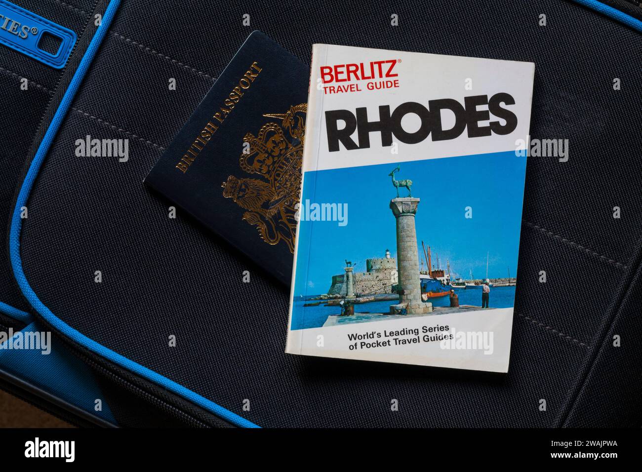 Rhodes Berlitz Travel Guide book with British passport on suitcase ...
