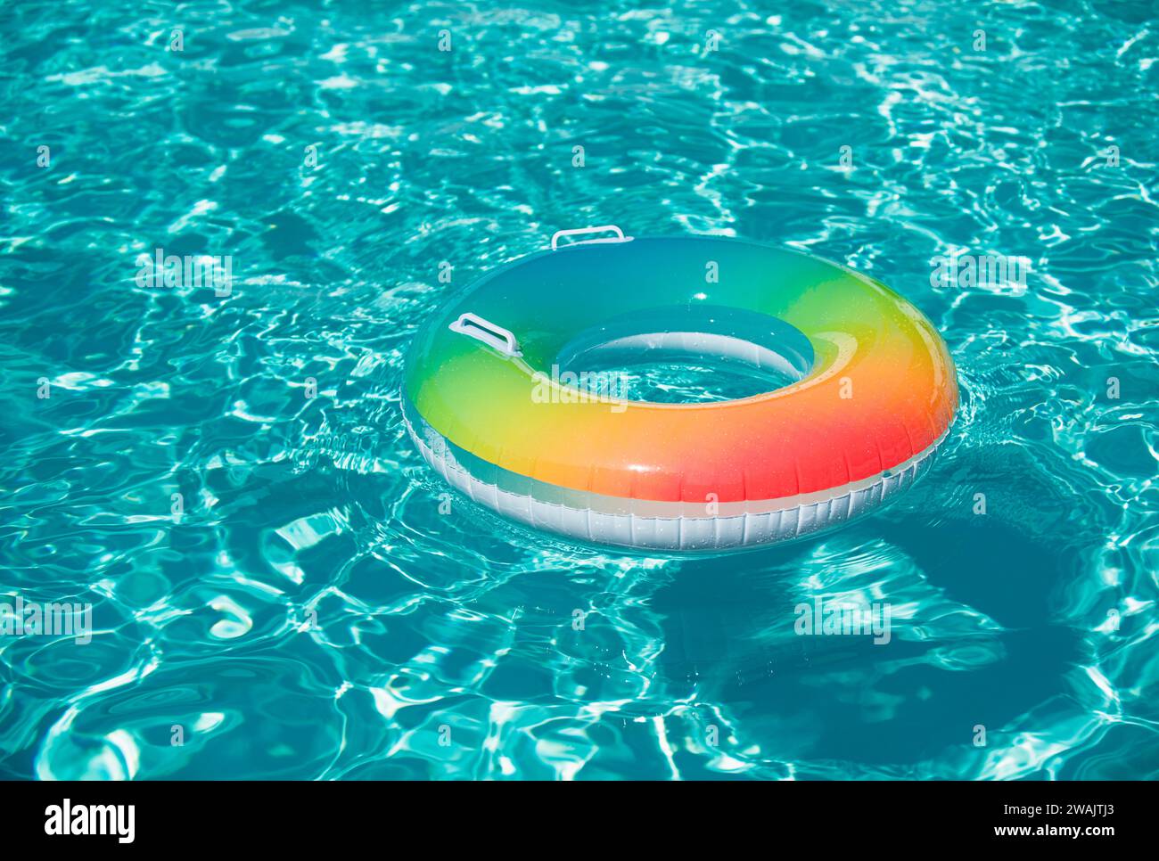 Inflatable ring in blue swimming pool. Summer pool water perfect ...