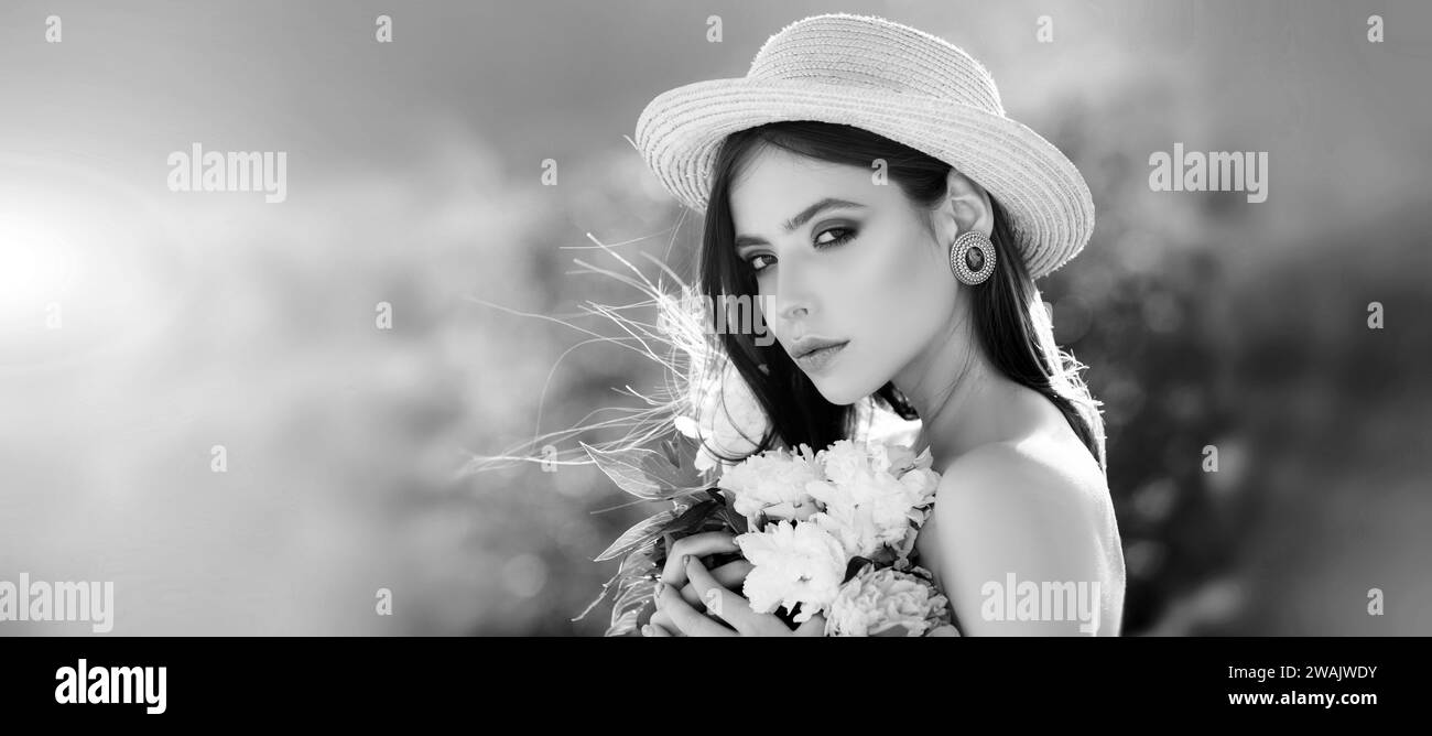Natural beauty face. Beautiful romantic young woman in spring flowers ...