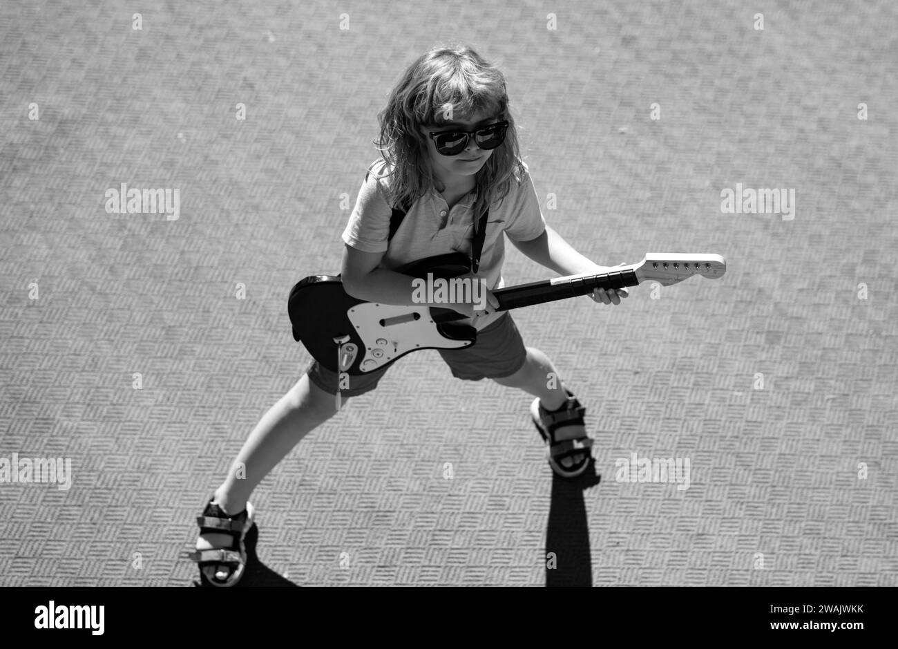 Little boy playing guitar outdoor. Child musician guitarist playing ...