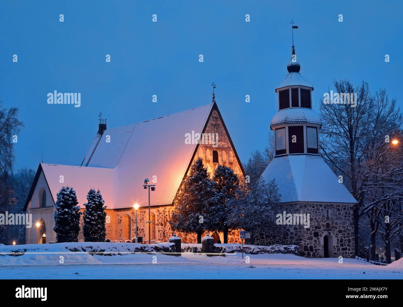 A medieval church illuminated in winter evening Stock Photo - Alamy